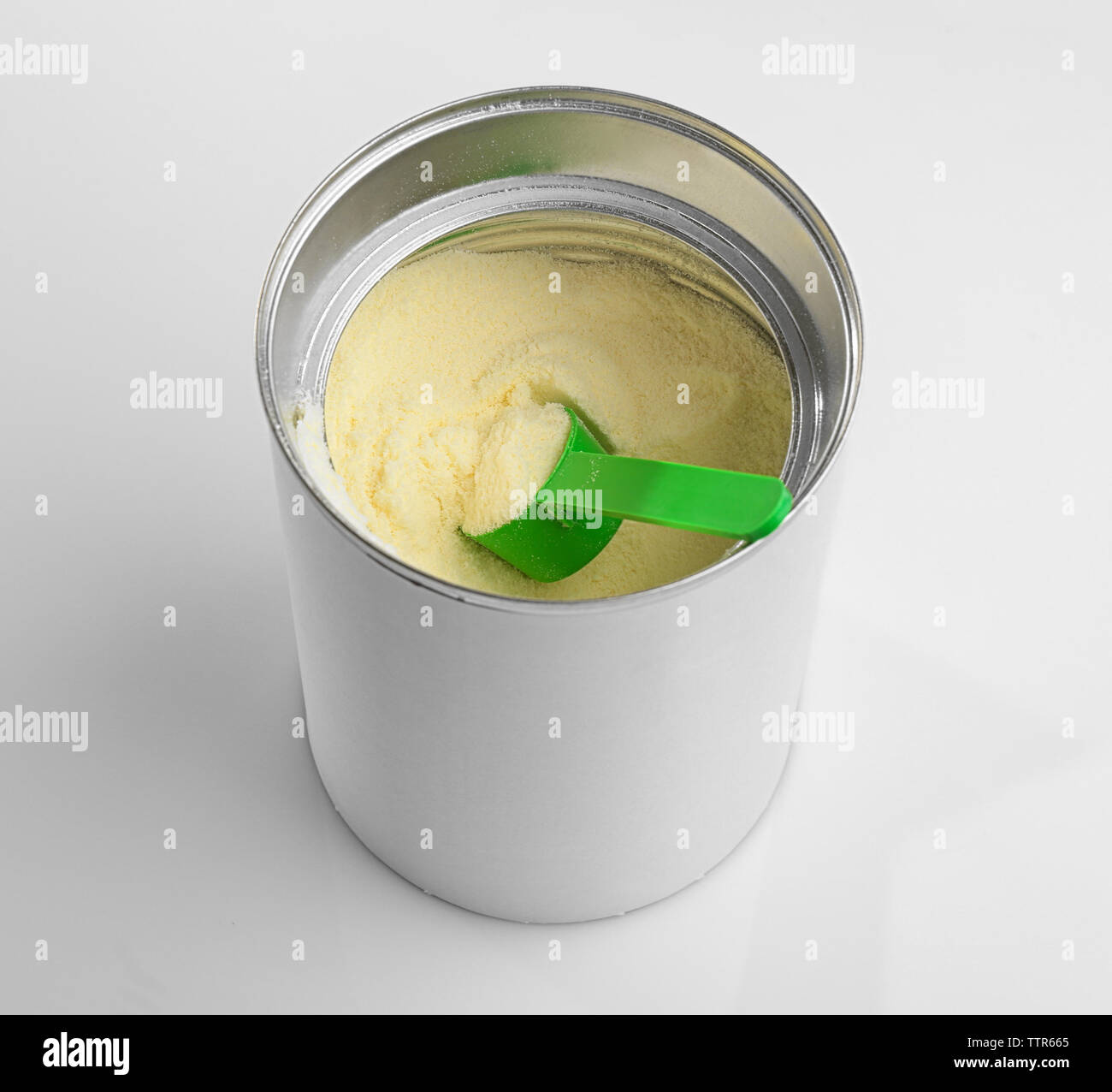 Baby milk formula in can on white background Stock Photo - Alamy