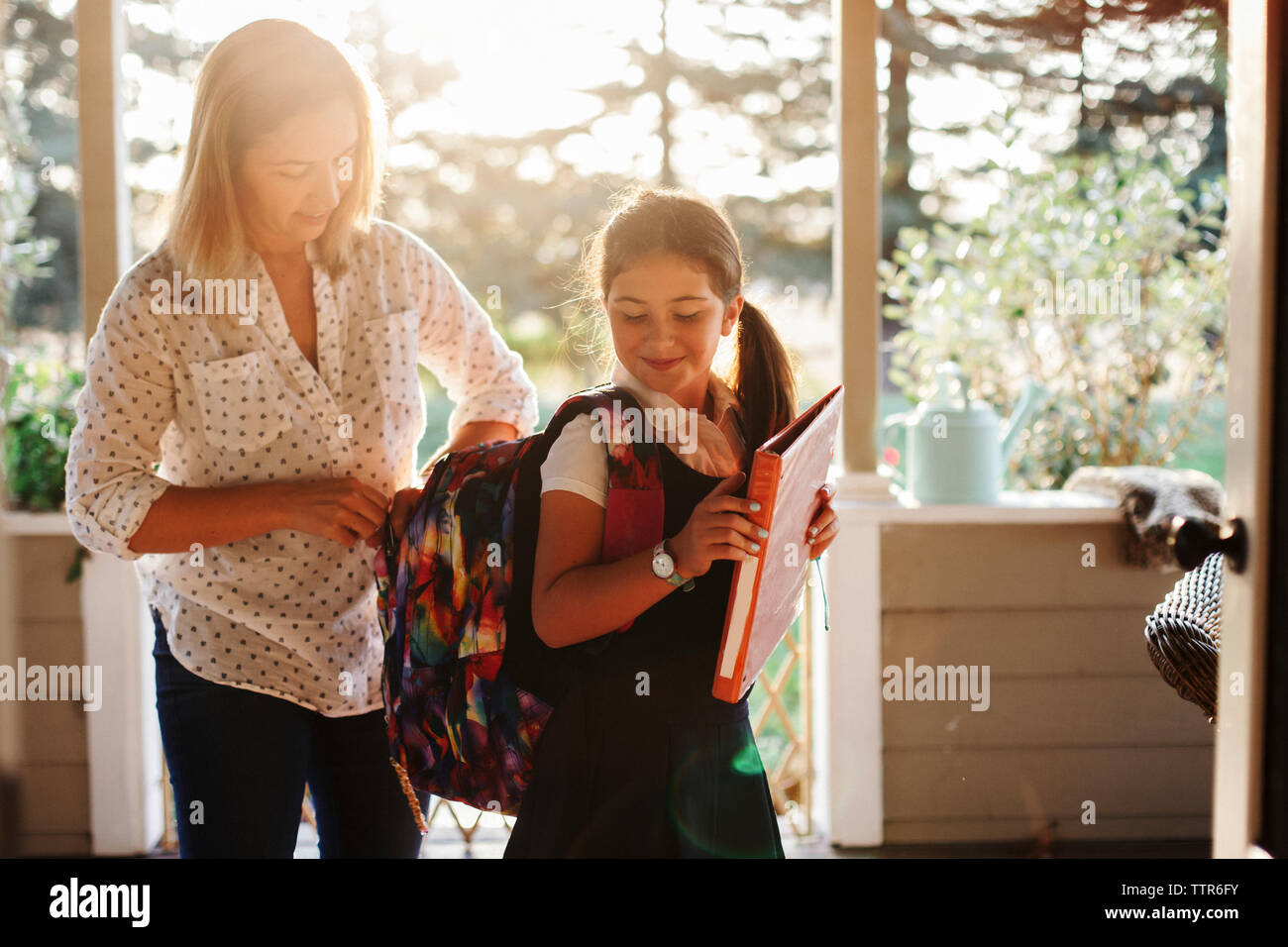 Girl packing backpack school hi-res stock photography and images - Alamy