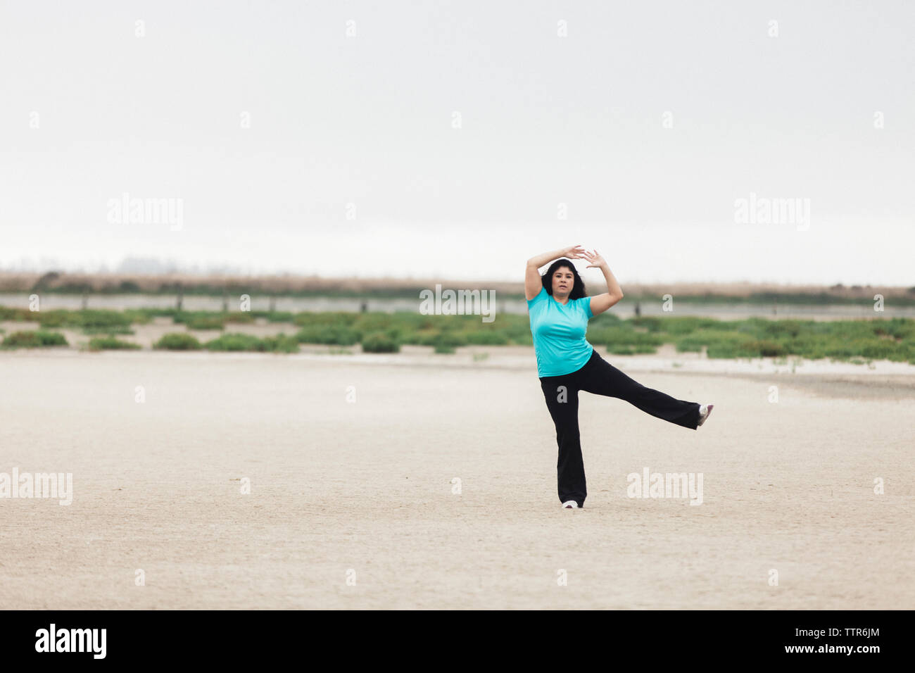 Stretching one leg hi-res stock photography and images - Alamy