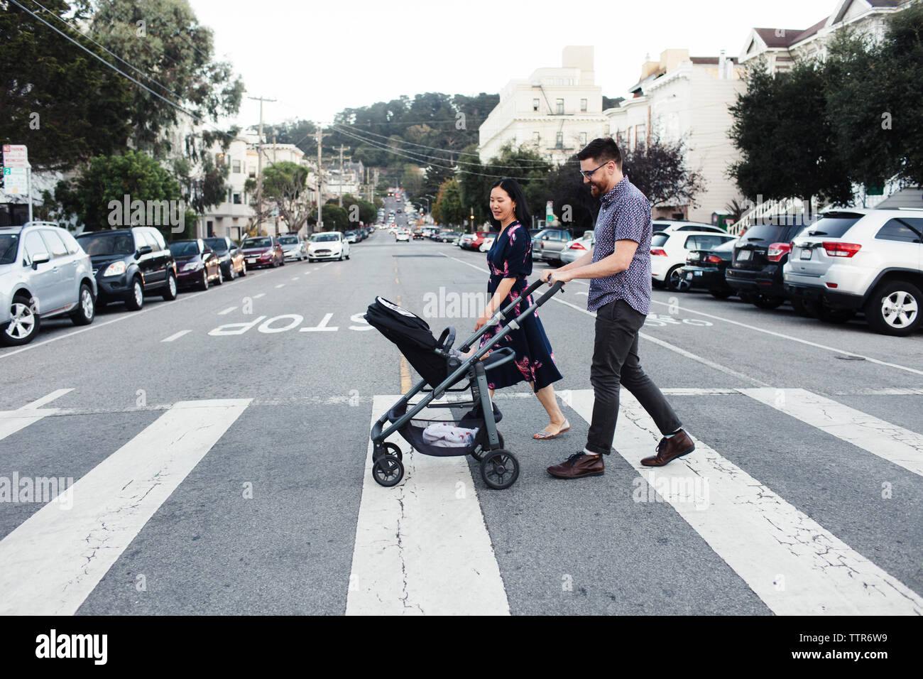 Family with stroller crossing street hi-res stock photography and ...