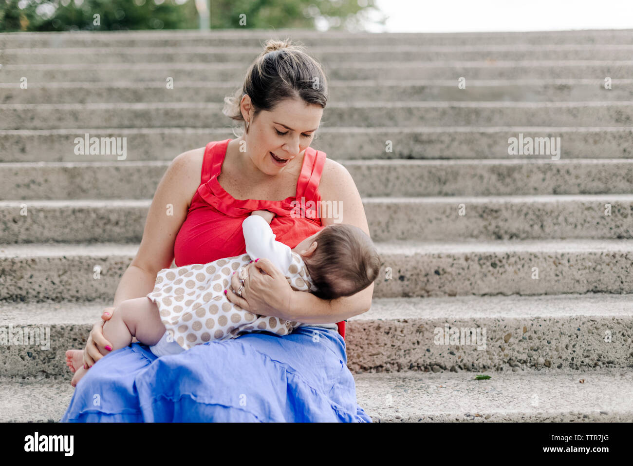 Woman breastfeeding her baby hi-res stock photography and images - Alamy