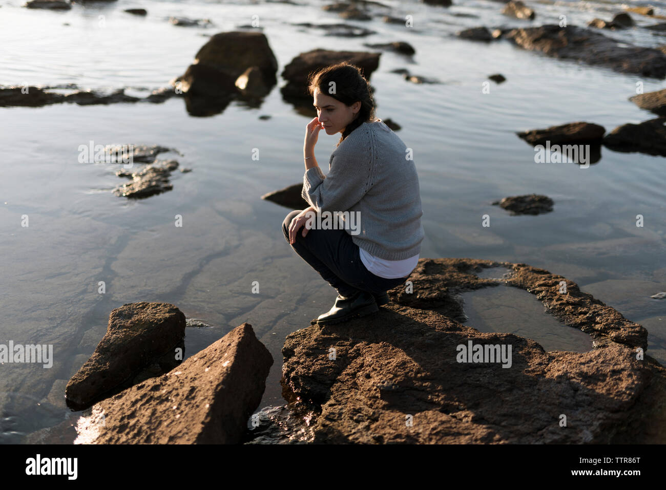 Woman crouching down hi-res stock photography and images - Alamy