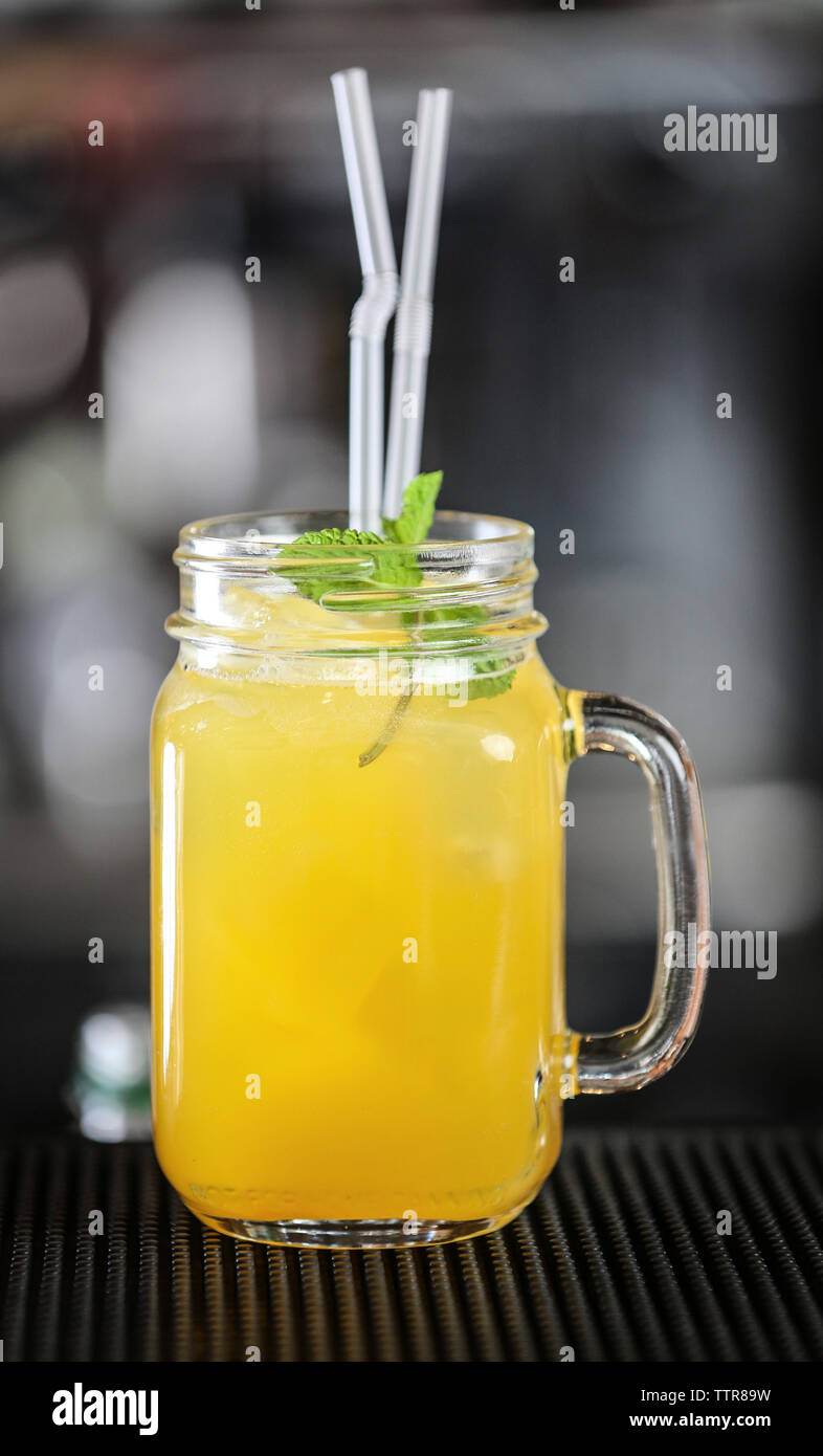 Cocktail in glass jar on bar counter Stock Photo - Alamy