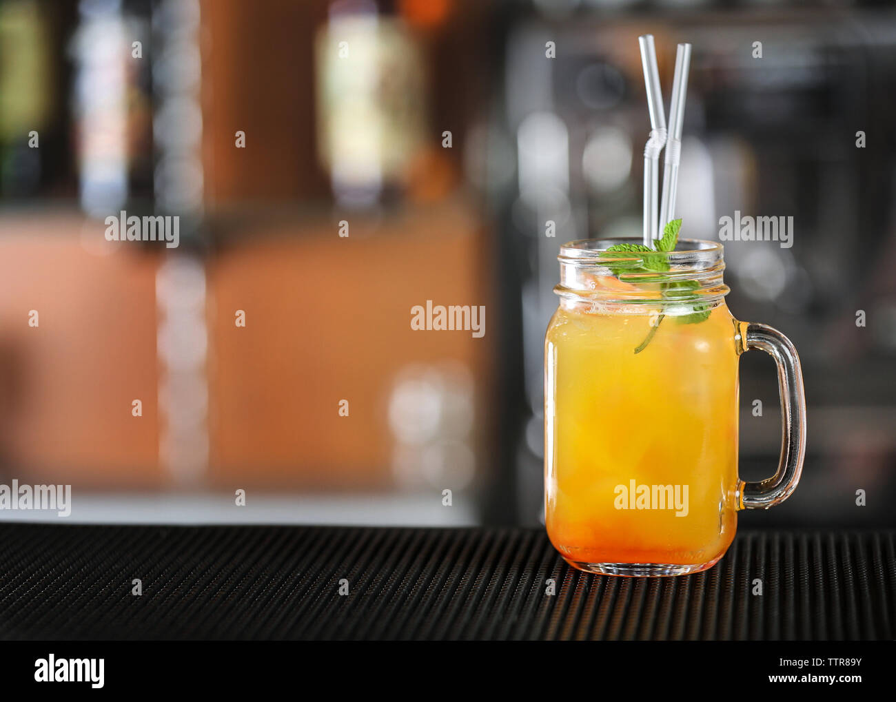 Cocktail in glass jar on bar counter Stock Photo - Alamy