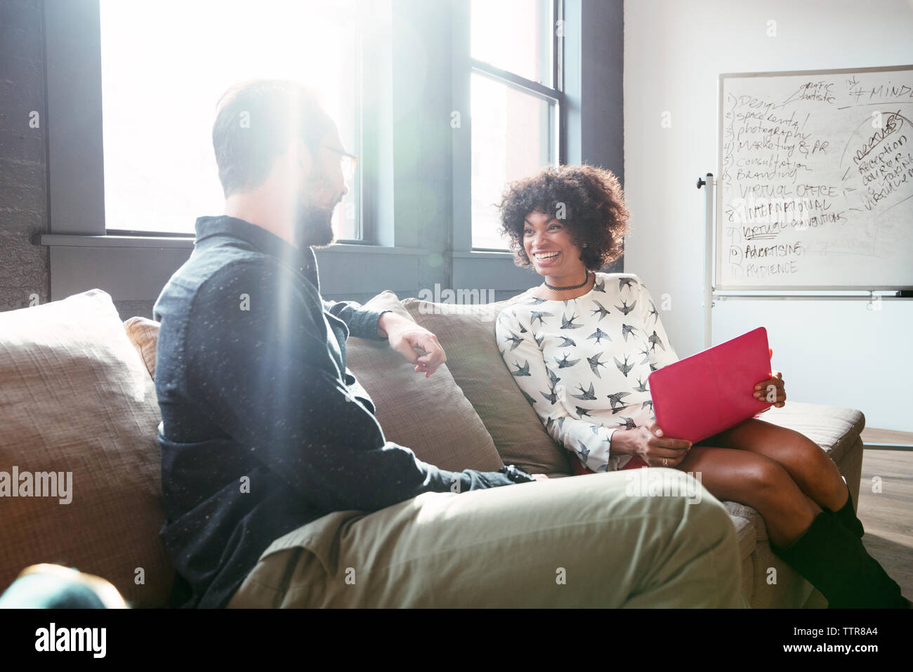Two people talking sofa hi-res stock photography and images - Alamy