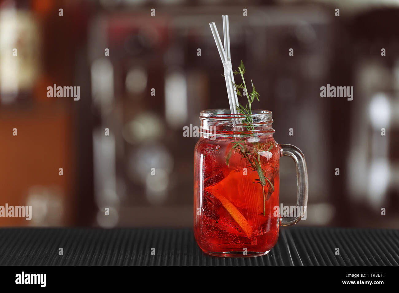 Cocktail in glass jar on bar counter Stock Photo - Alamy
