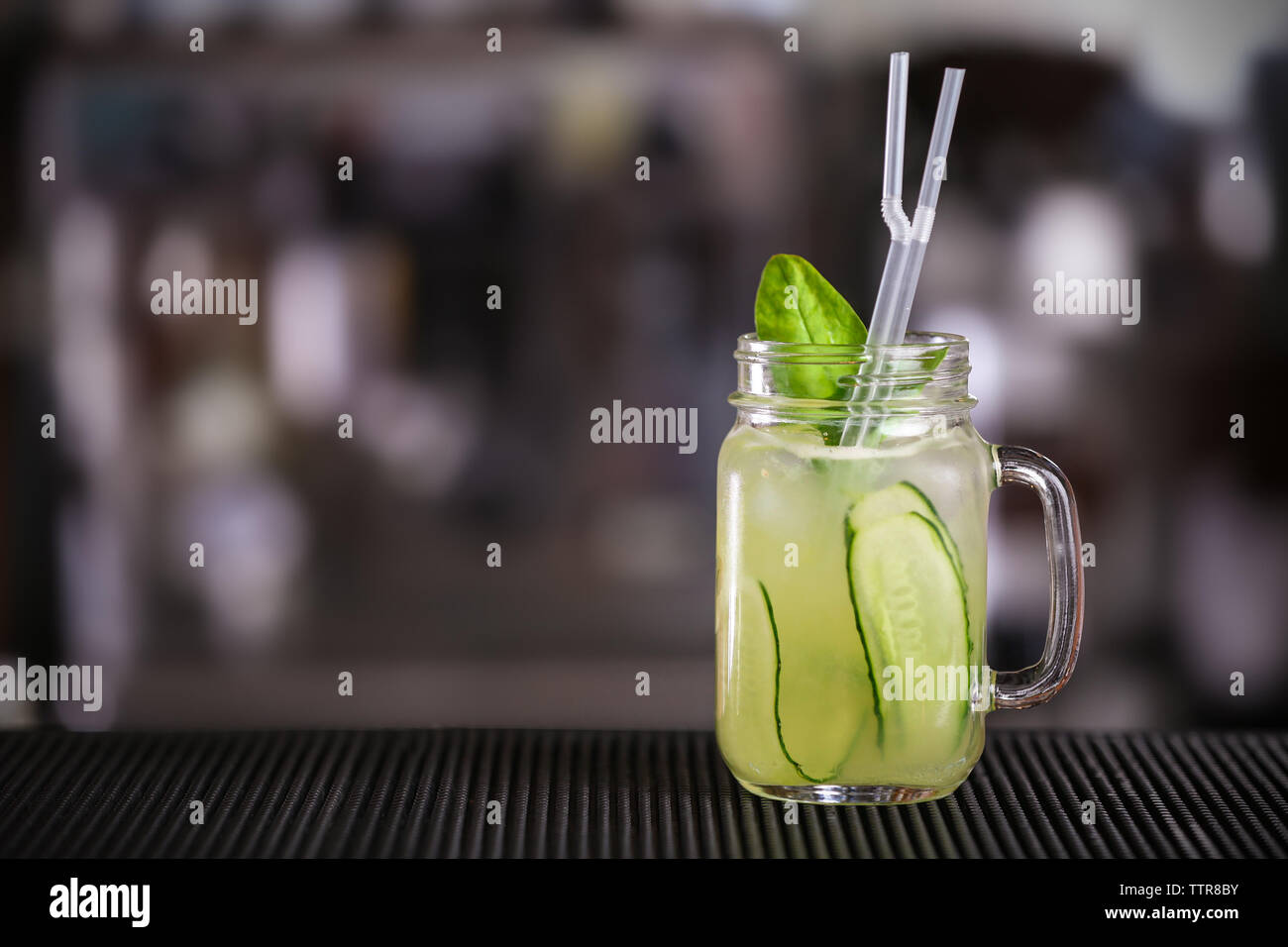 Cocktail in glass jar on bar counter Stock Photo - Alamy