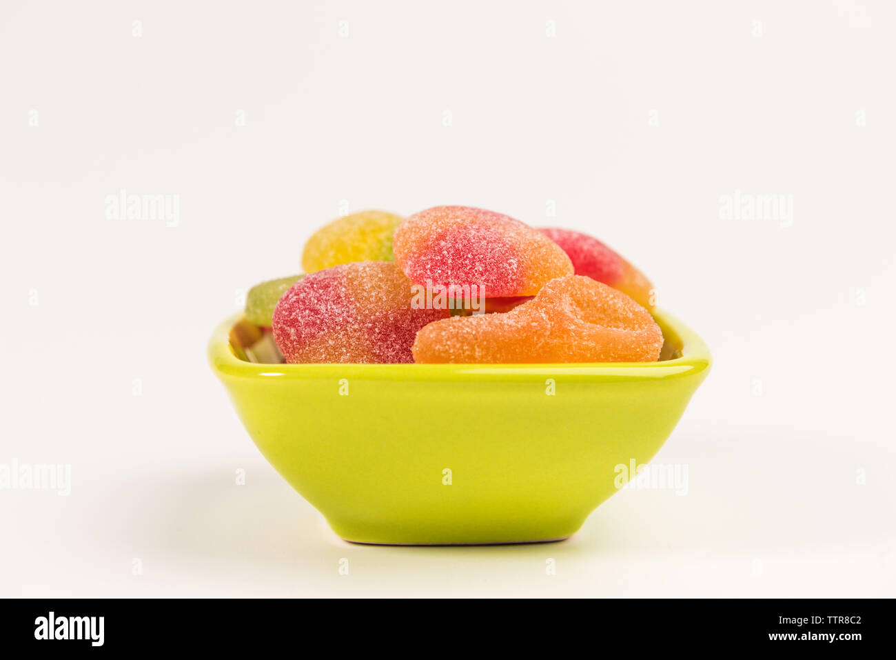 Small bowl with gummy candies isolated on white background Stock Photo ...