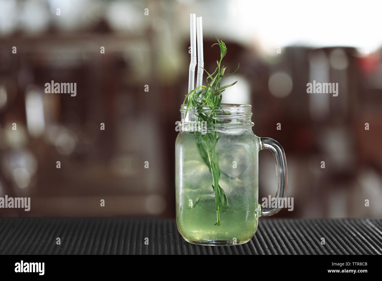 Cocktail in glass jar on bar counter Stock Photo - Alamy