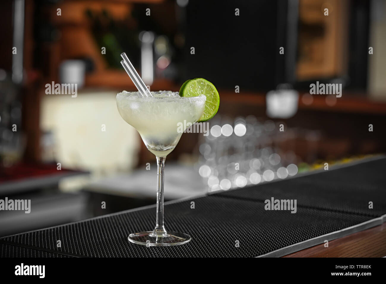 Cocktail in glass on bar counter Stock Photo - Alamy