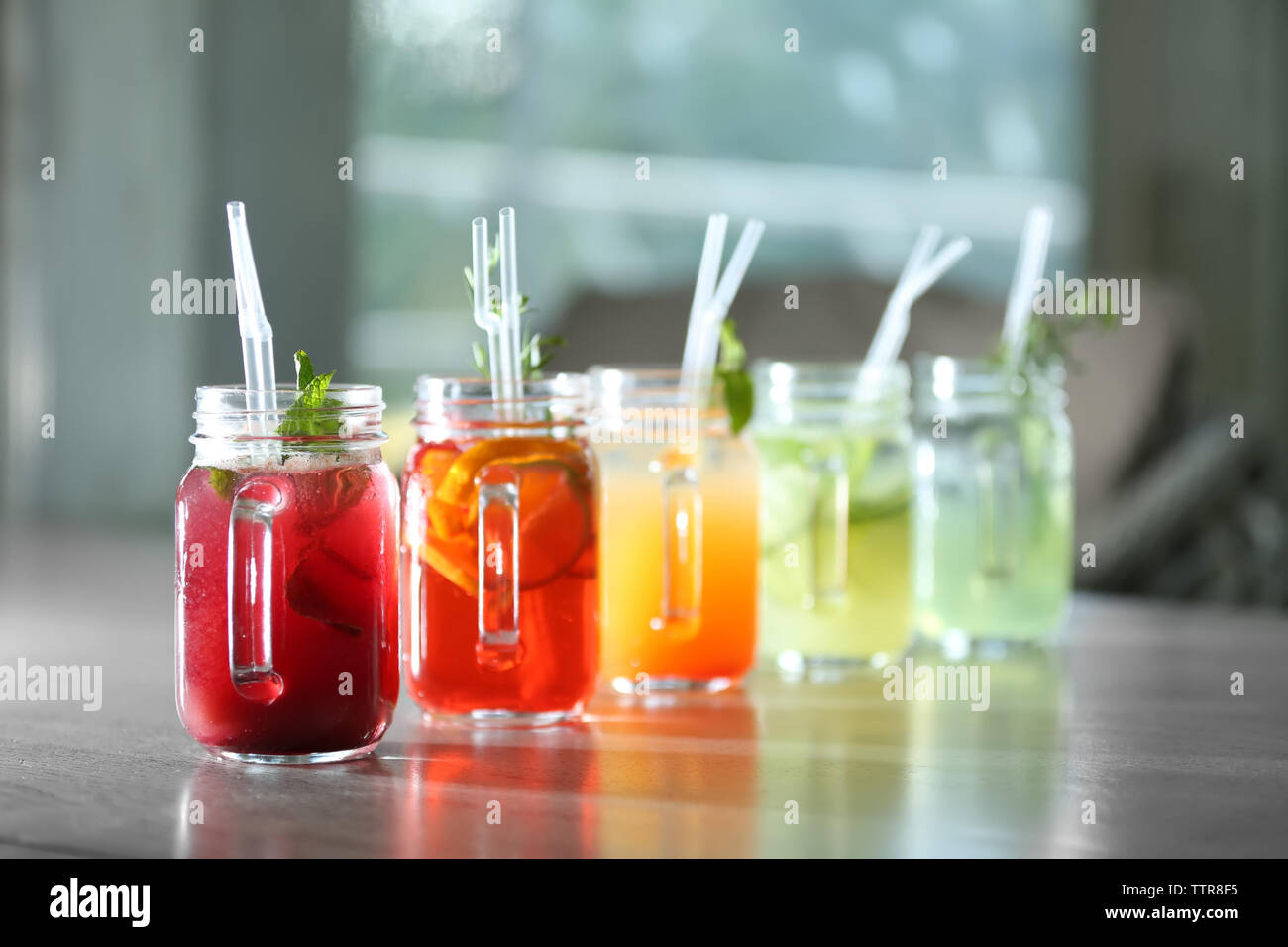 Different cocktails on table in cafe Stock Photo - Alamy