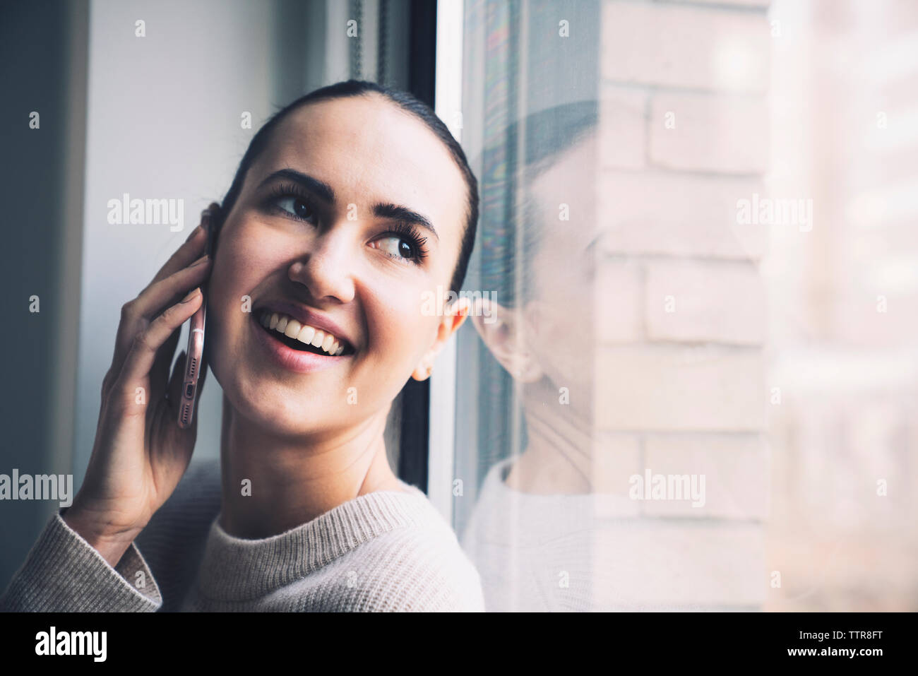 Woman window happy home hi-res stock photography and images - Alamy