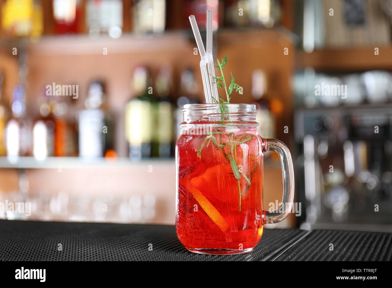 Cocktail in glass jar on bar counter Stock Photo - Alamy