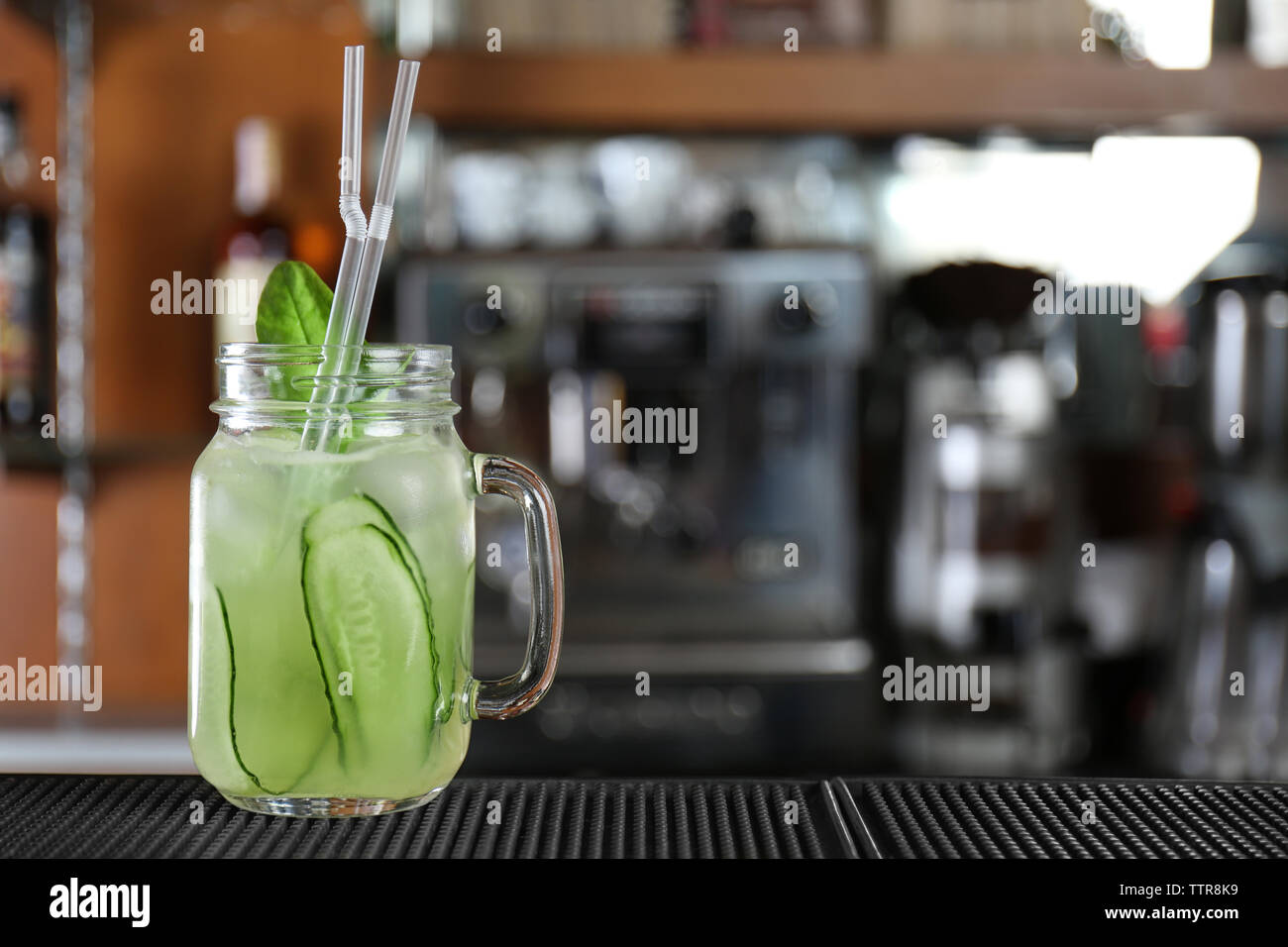 Cocktail in glass jar on bar counter Stock Photo - Alamy