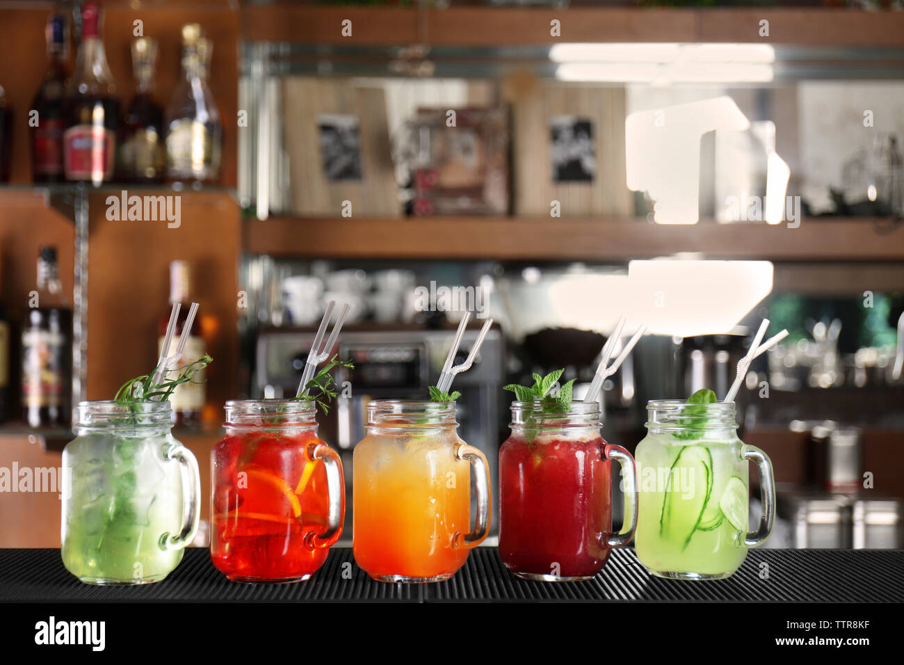 Different cocktails on table in cafe Stock Photo - Alamy