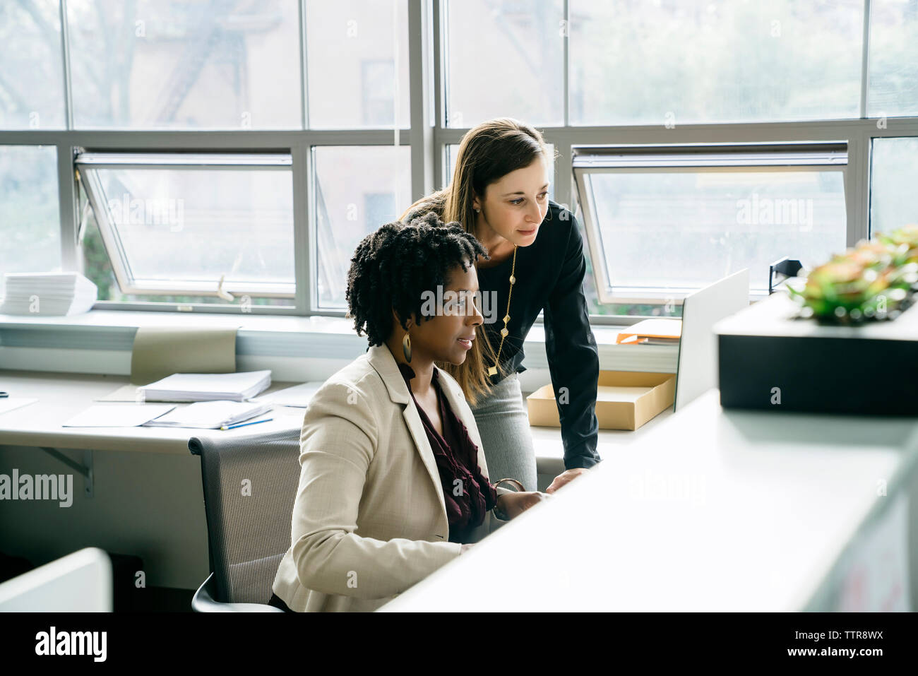 businesswomen using desktop computer in office Stock Photo - Alamy