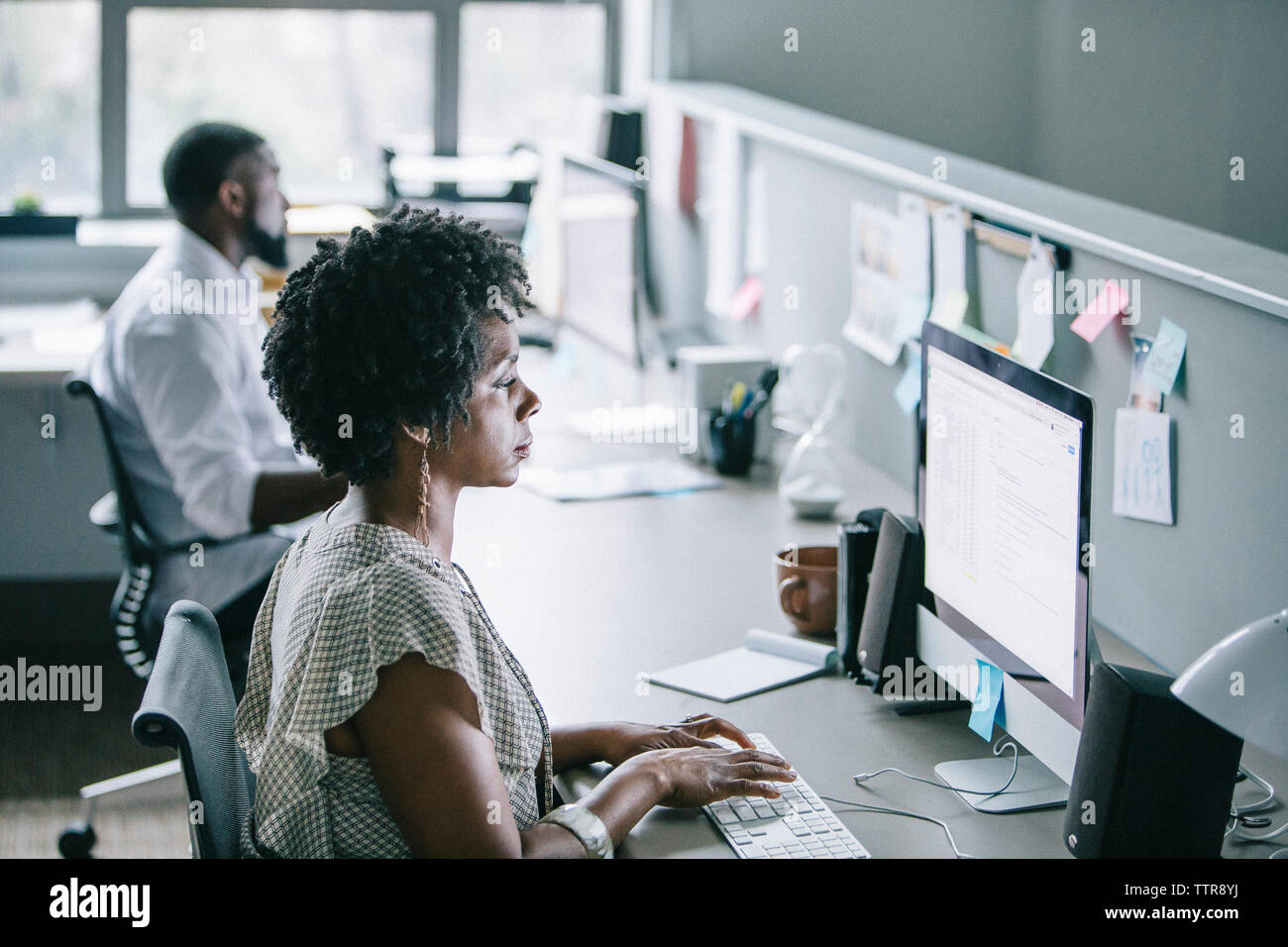 Business colleagues using computers hi-res stock photography and images ...