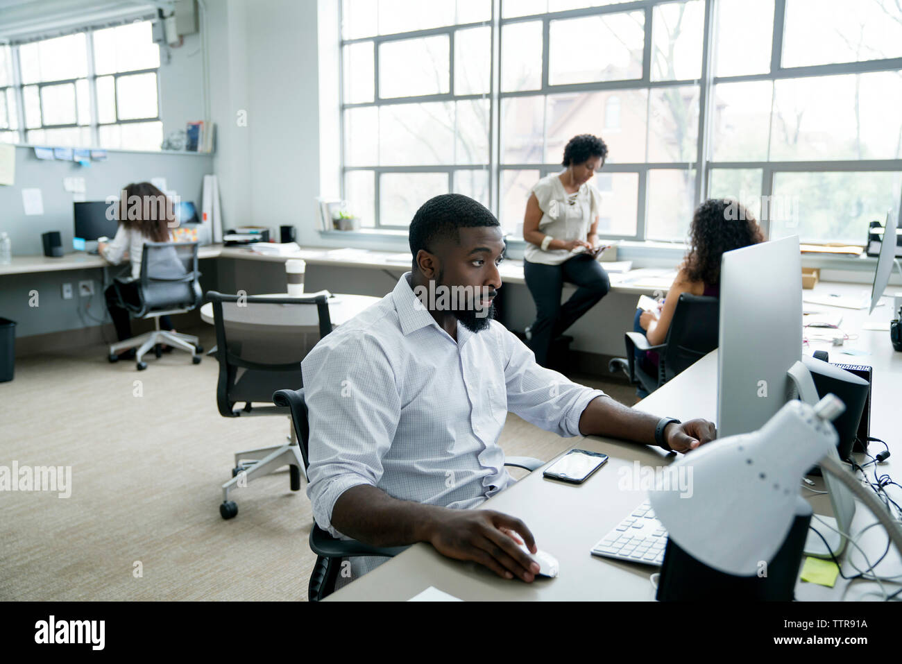 business people working at desk in office Stock Photo - Alamy