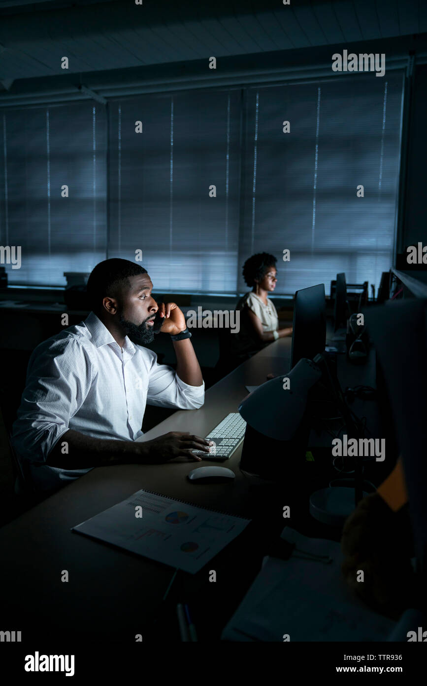 Working with two computers hi-res stock photography and images - Alamy