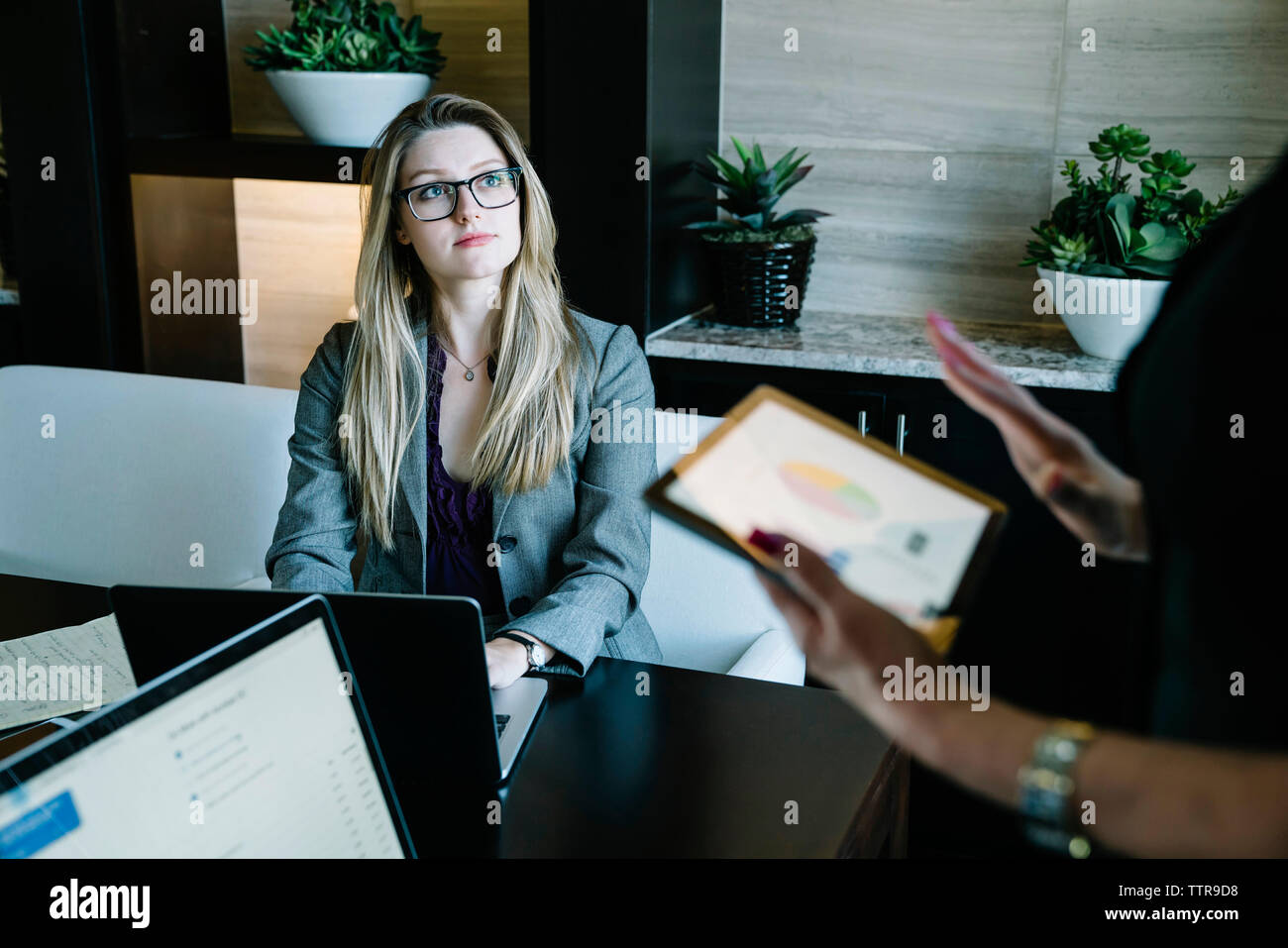 Colleagues looking computer screen high hi-res stock photography and ...