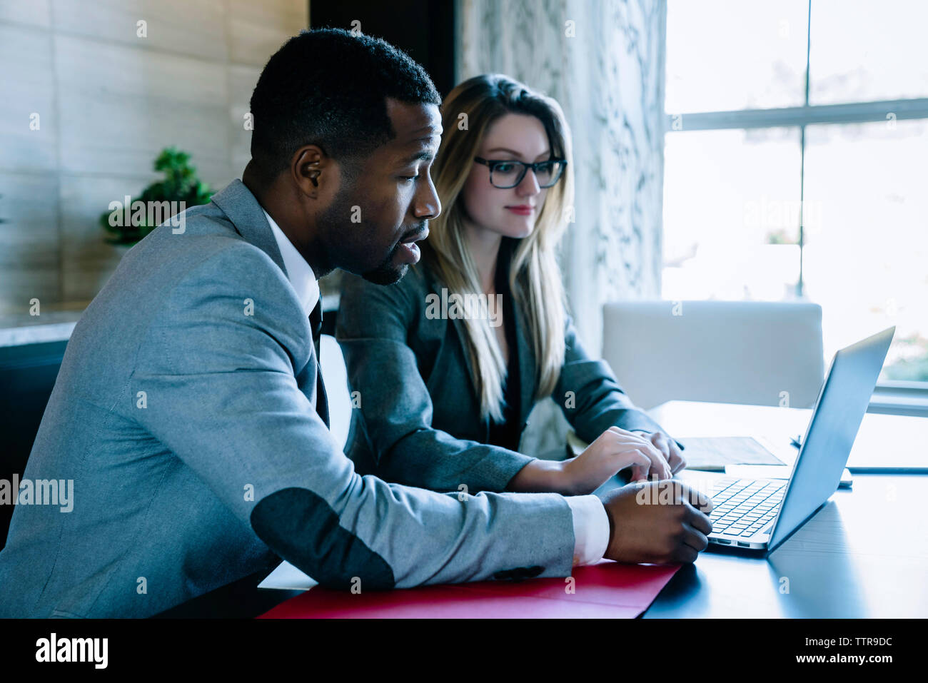 Young business entrepreneurs discussing hi-res stock photography and ...