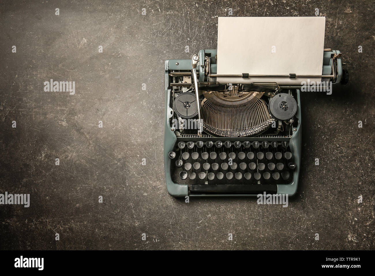 Vintage typewriter on a color background Stock Photo - Alamy