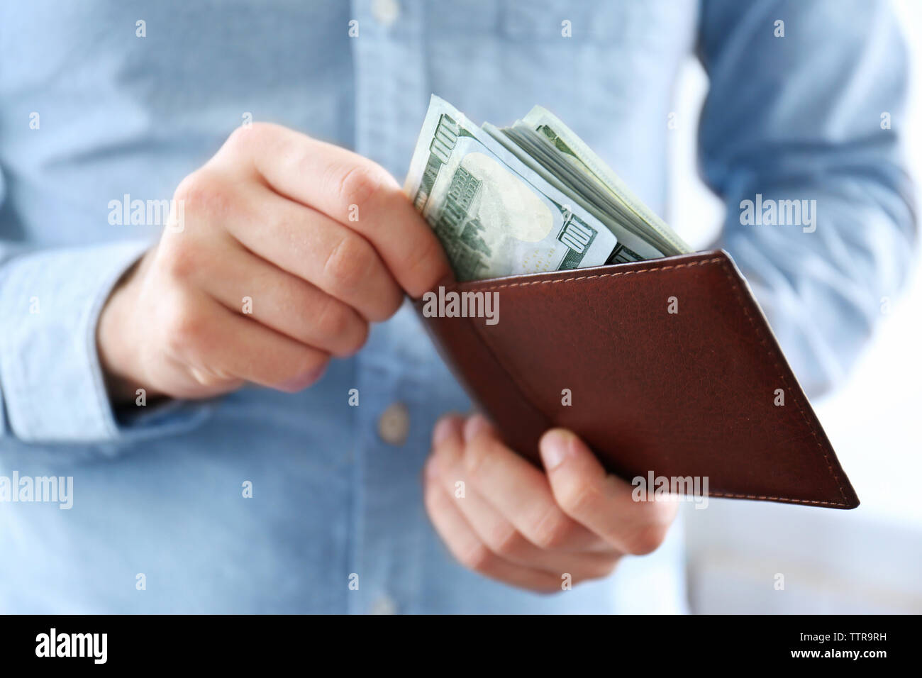 Reaching for wallet hi-res stock photography and images - Alamy