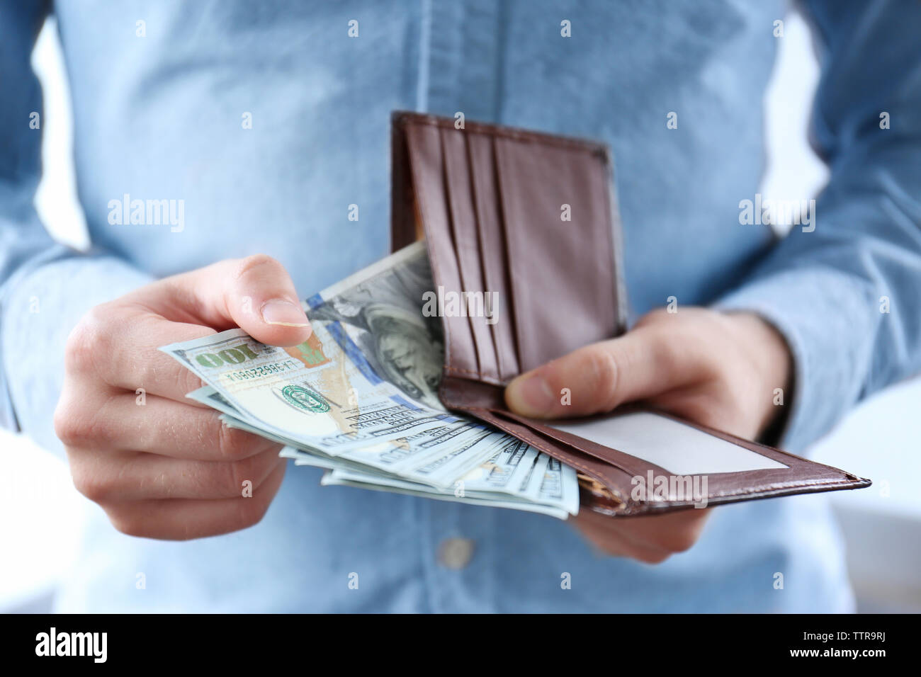 Reaching for wallet hi-res stock photography and images - Alamy