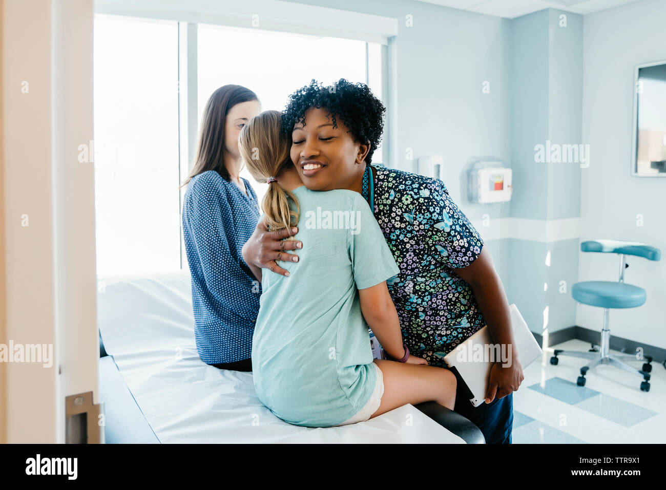 Exam table patient sitting hi-res stock photography and images - Alamy