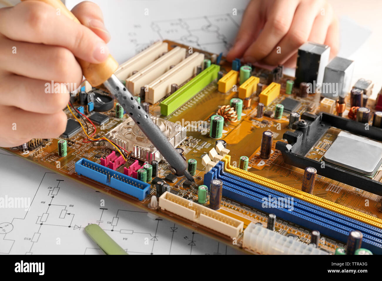 Man repairing motherboard, closeup Stock Photo - Alamy