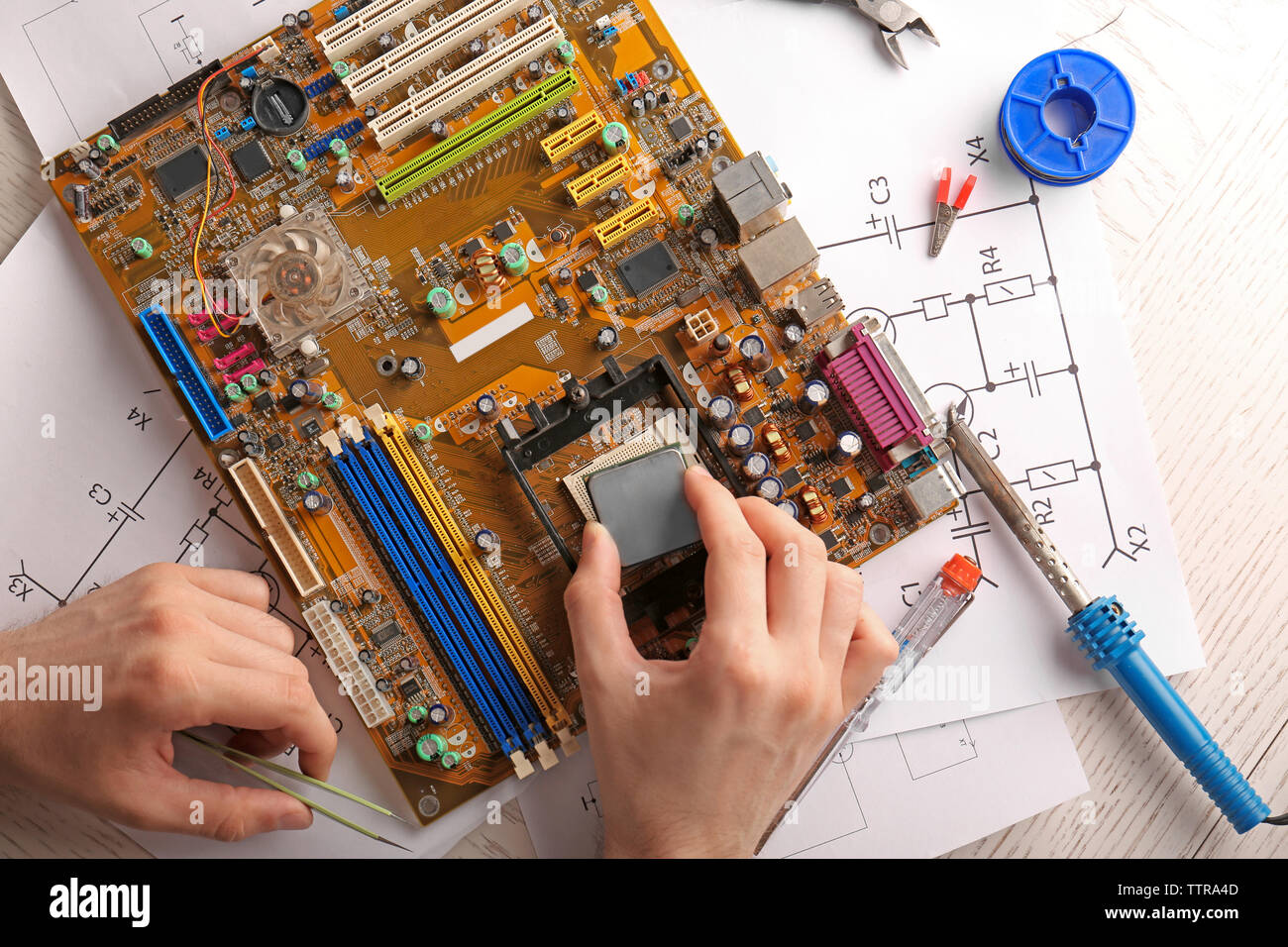 Man repairing motherboard, closeup Stock Photo - Alamy