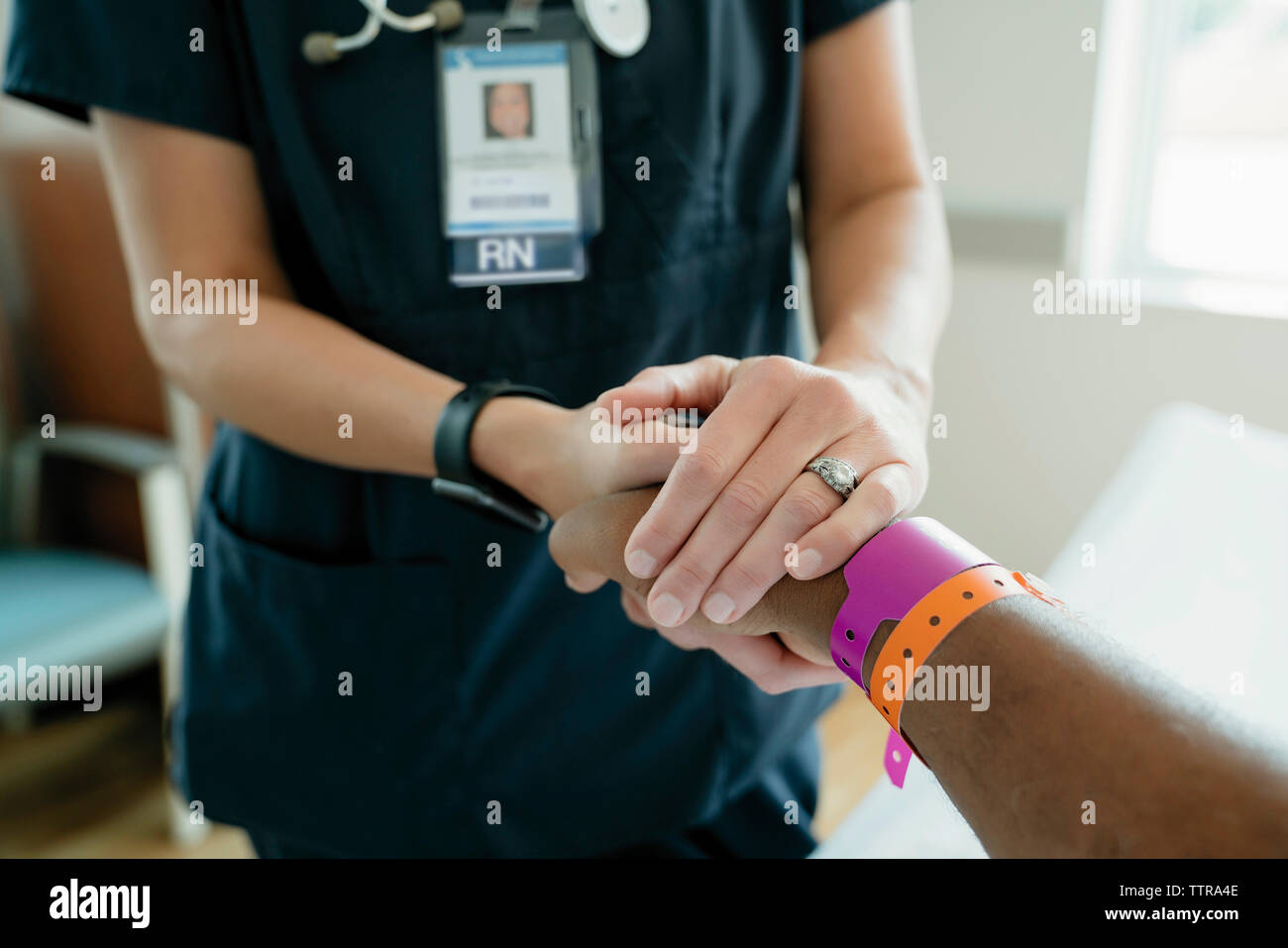 Nurse holding patients hand hi-res stock photography and images - Alamy