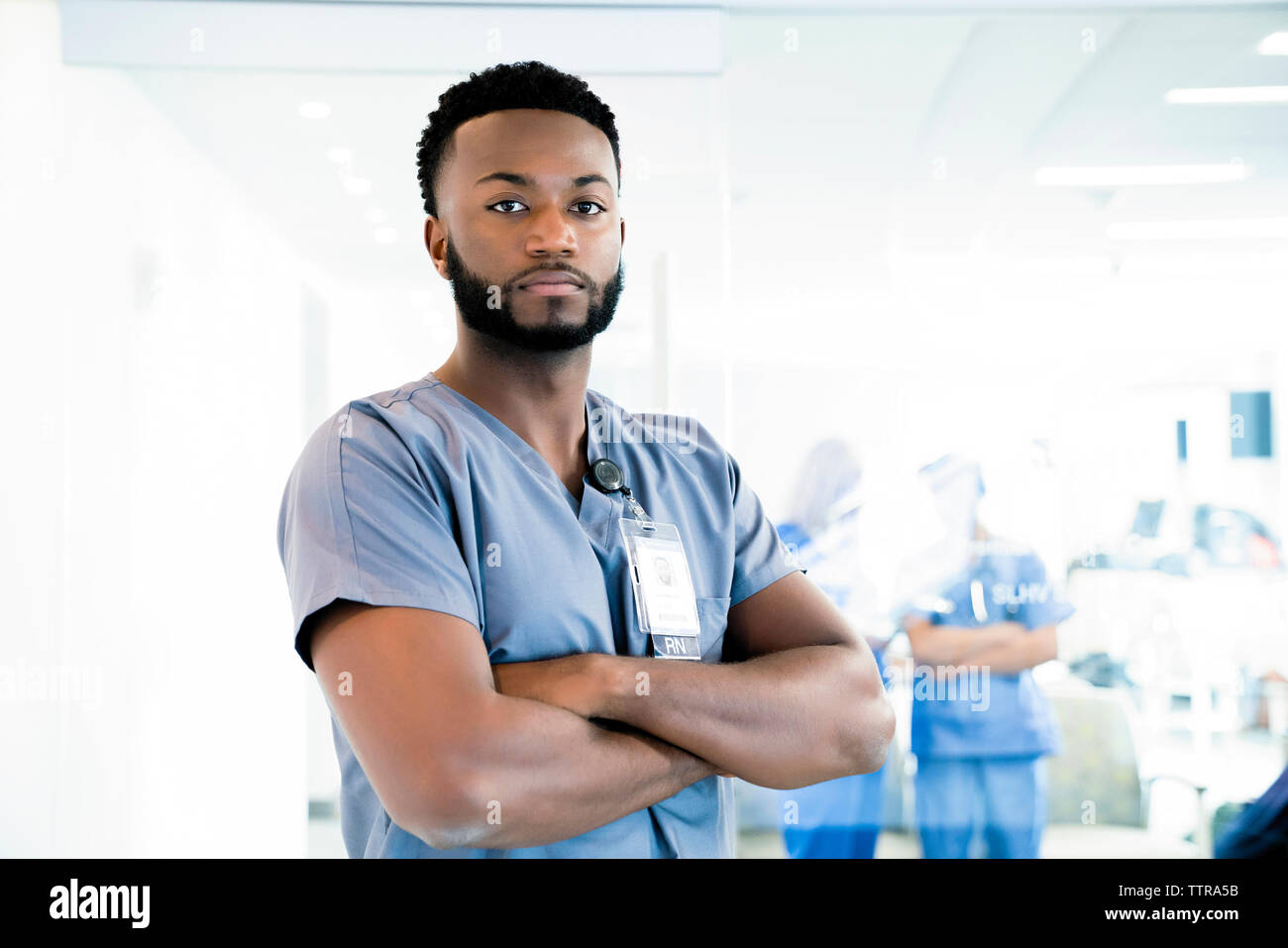 Doctor portrait arms crossed hi-res stock photography and images - Alamy