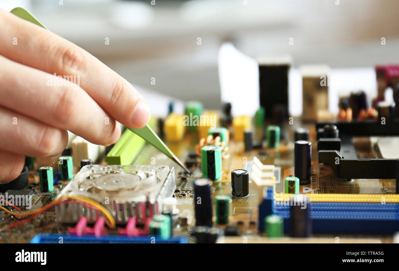 Man repairing mother board hi-res stock photography and images - Alamy
