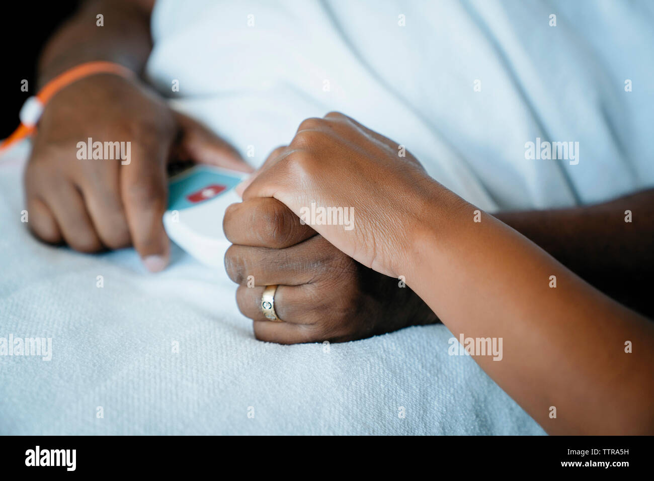 Holding hands hospital mature hi-res stock photography and images - Alamy