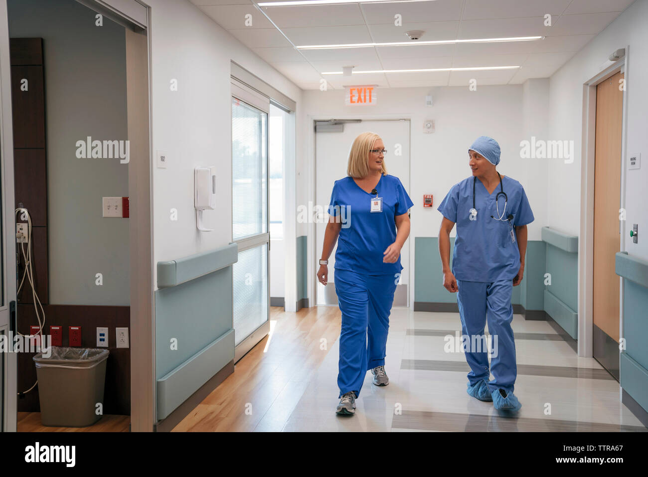 Female nurse walking hospital corridor hi-res stock photography and ...