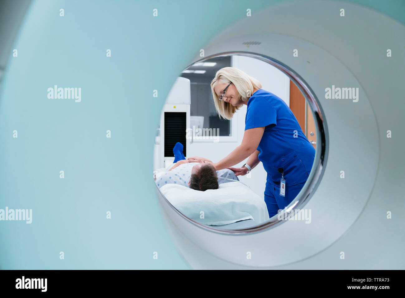 Nurse preparing patient for MRI Scan in hospital Stock Photo - Alamy