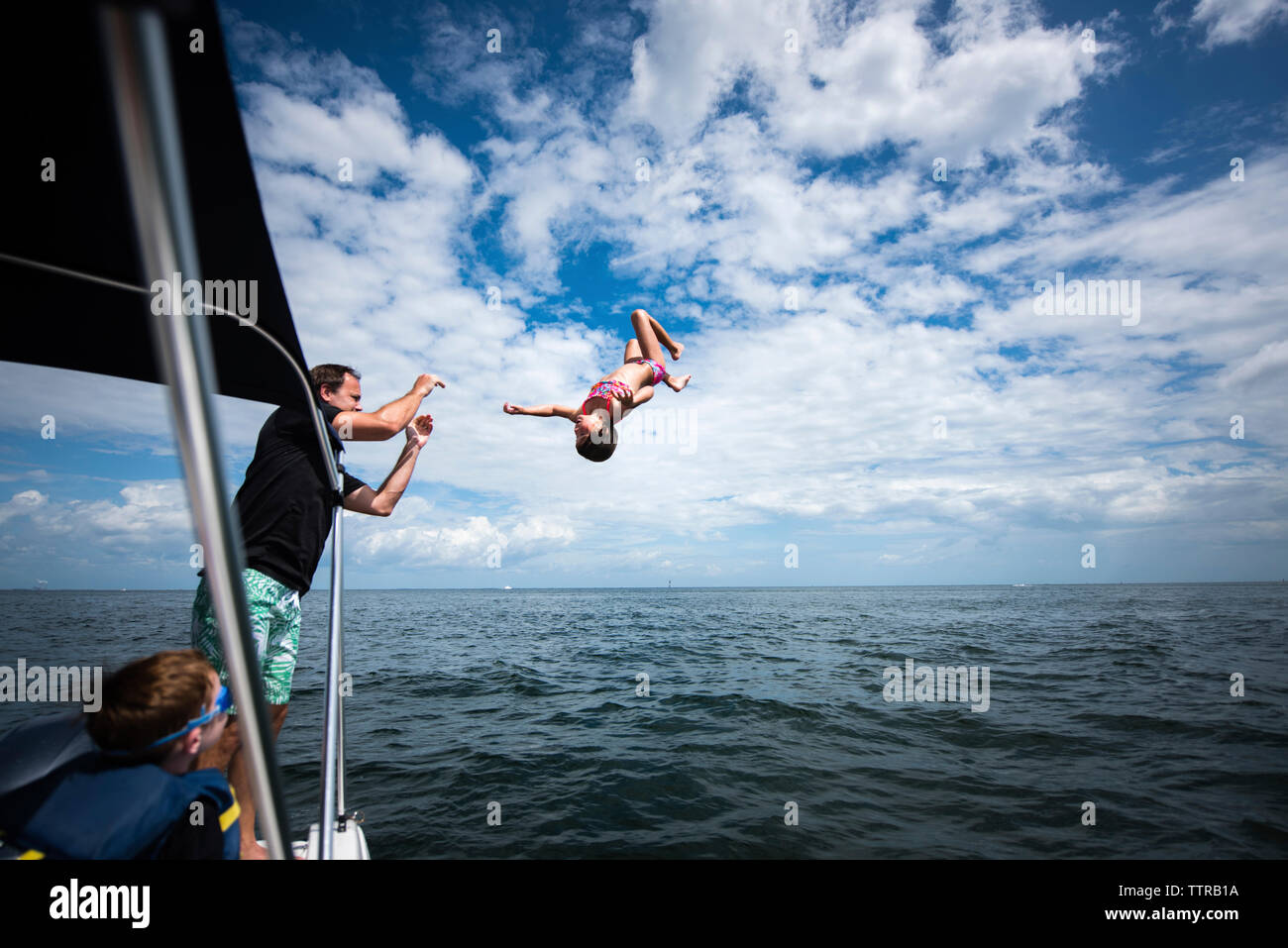 Boy girl jumping water hi-res stock photography and images - Alamy