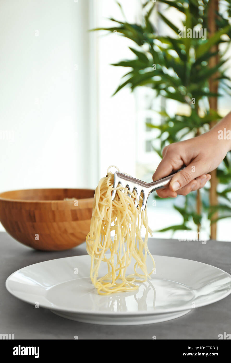 Hand with spaghetti hi-res stock photography and images - Alamy