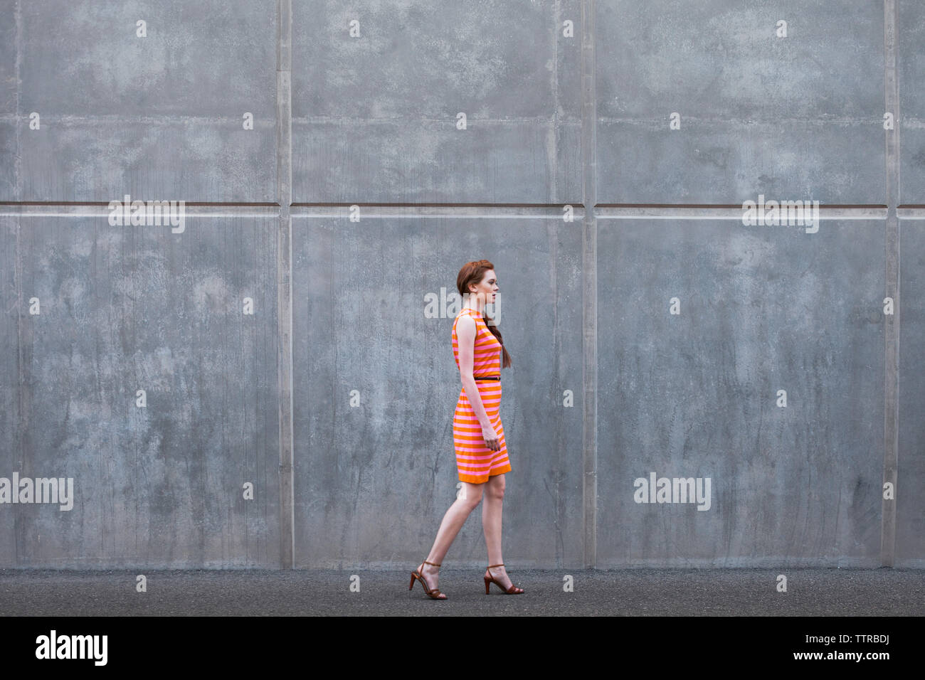 Woman side profile walking hi-res stock photography and images - Alamy