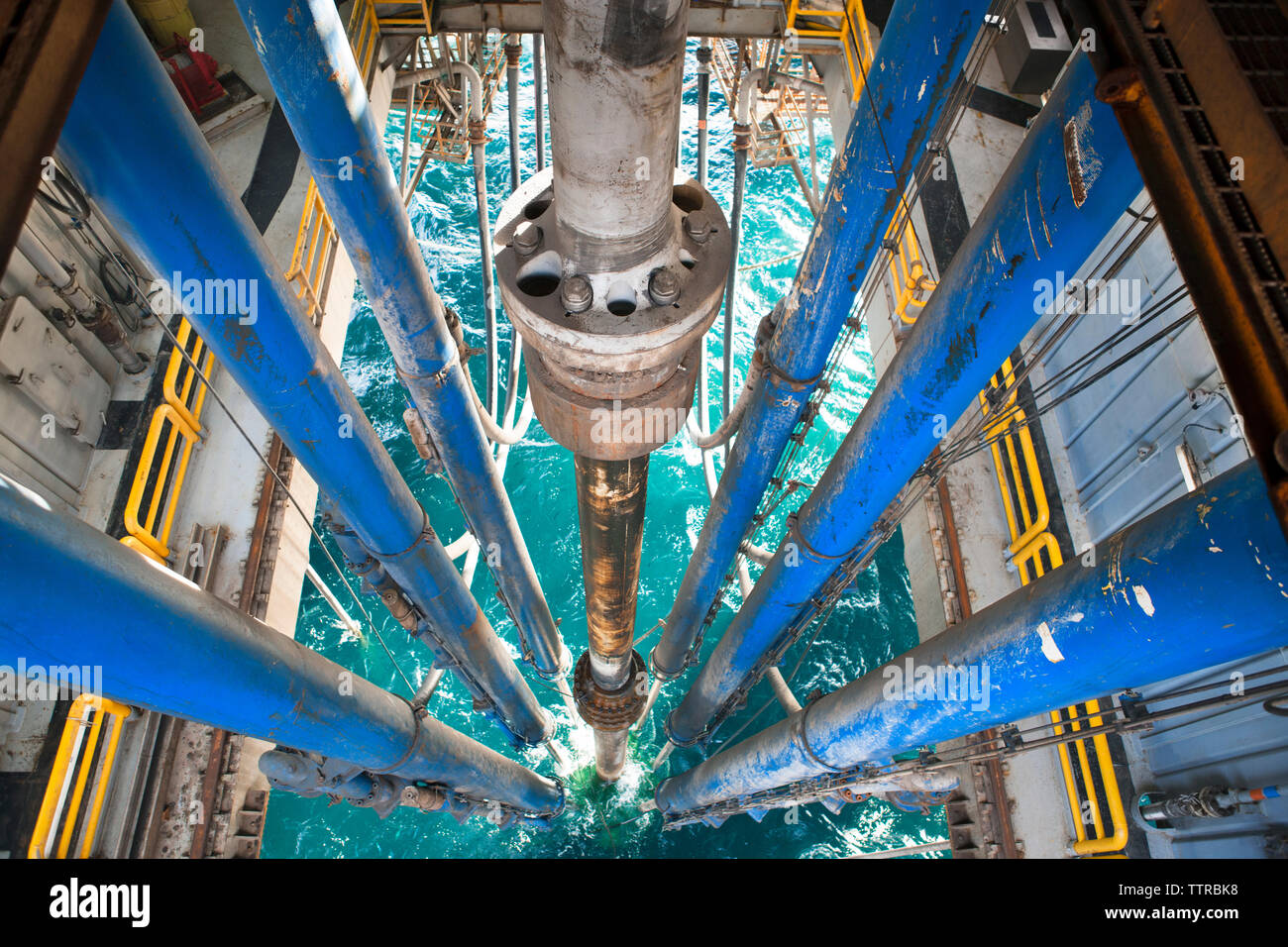 High angle view of drilling riser and pipes in sea at oil rig Stock ...
