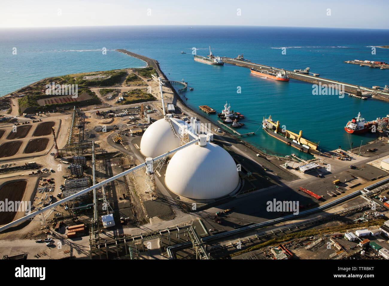Aerial view of storage tanks at commercial dock Stock Photo - Alamy