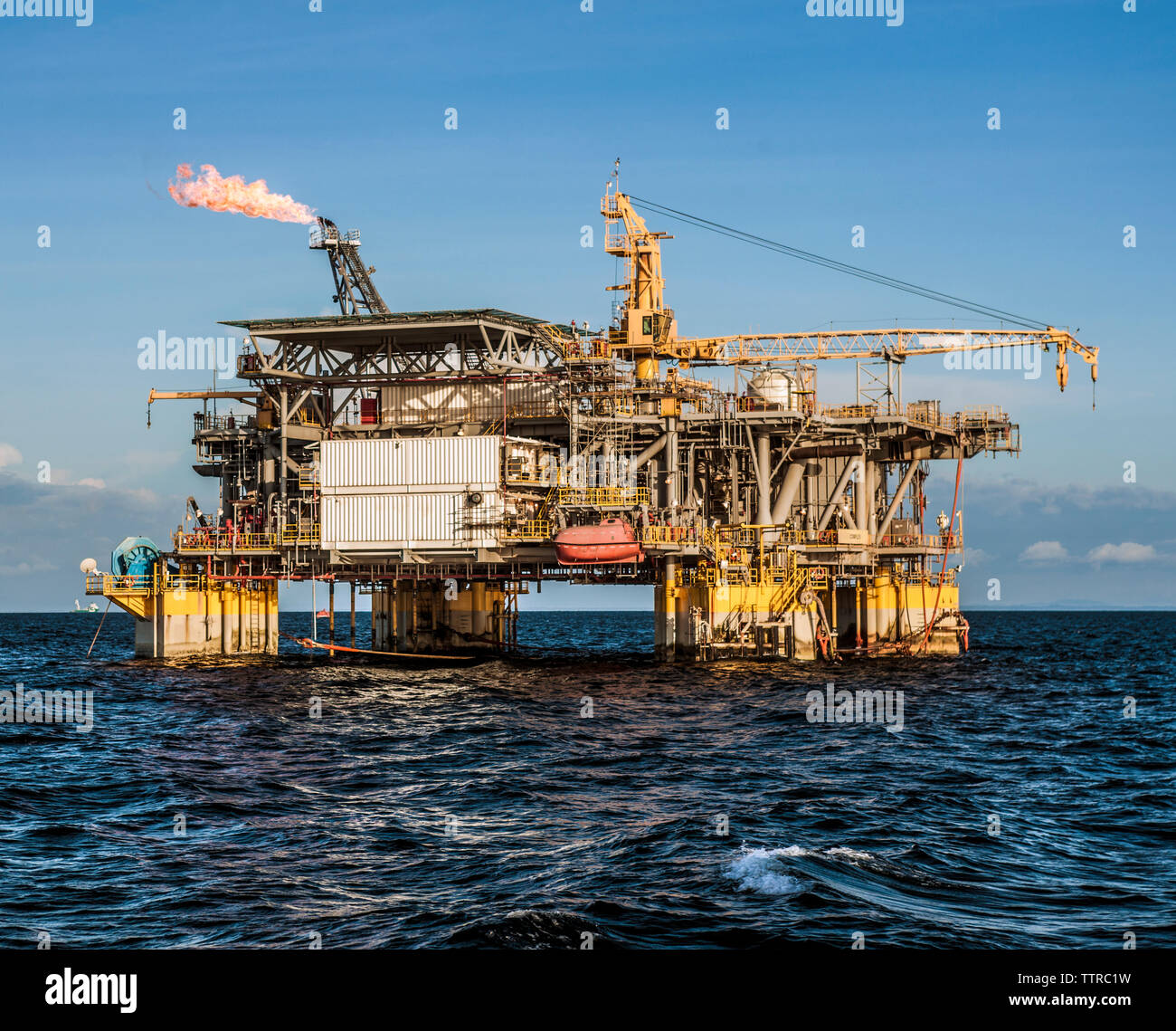 Oil production platform amidst sea Stock Photo - Alamy