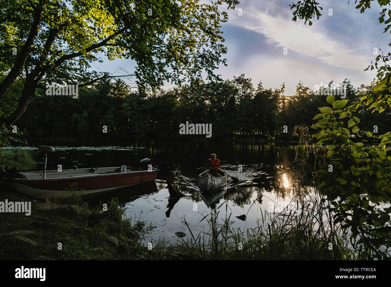 Boy rowing boat hi-res stock photography and images - Alamy
