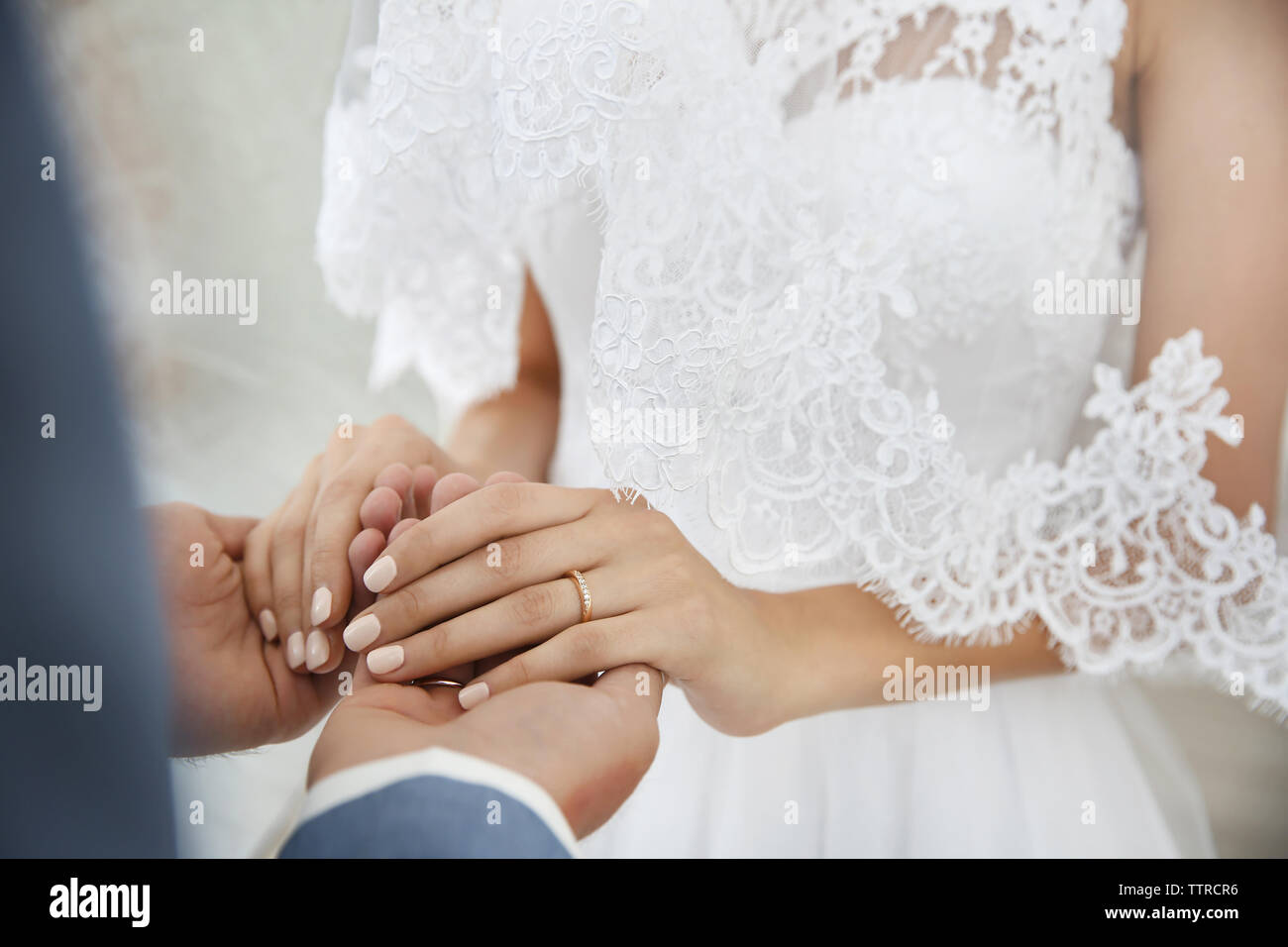Bride and groom hands, closeup Stock Photo - Alamy
