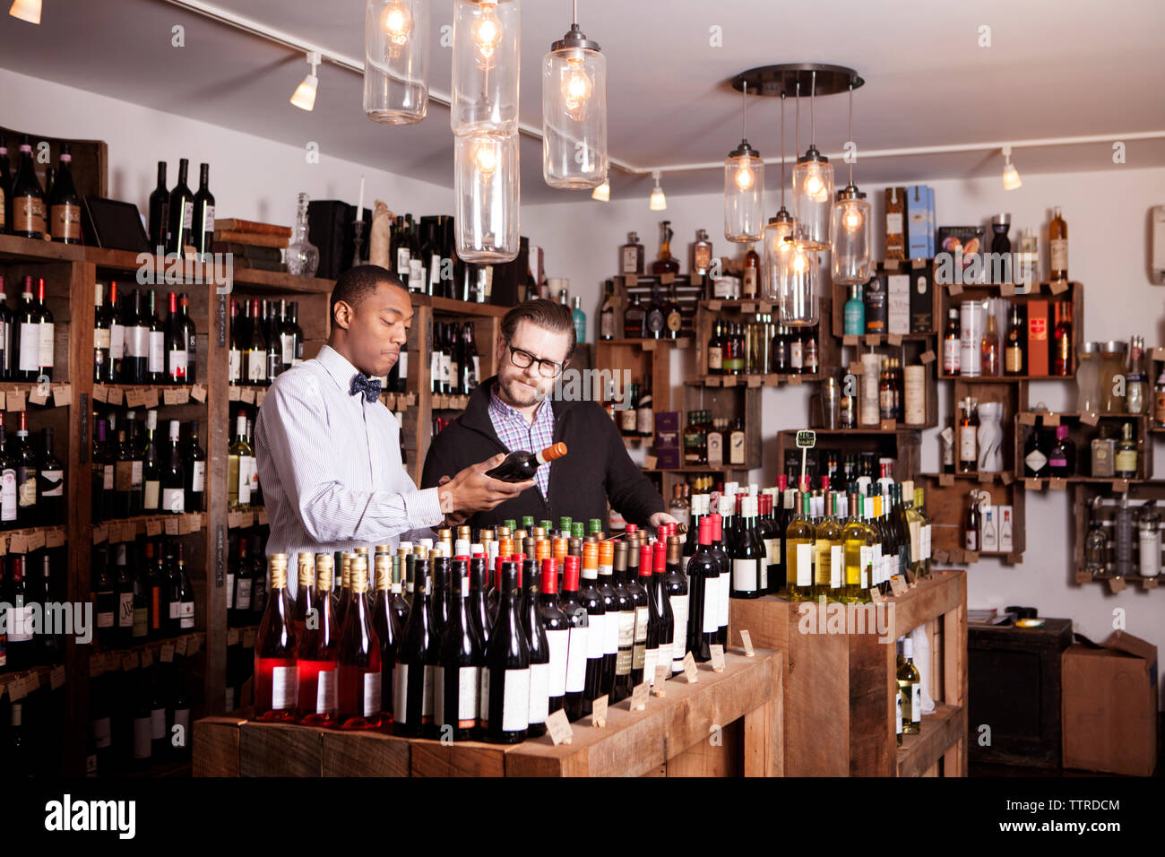 Reading label on bottle hi-res stock photography and images - Alamy