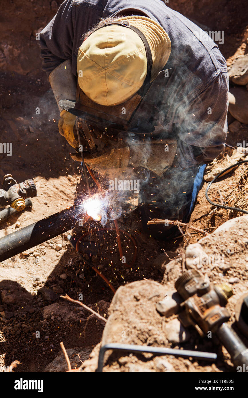 Man holding metal pipe hi-res stock photography and images - Alamy