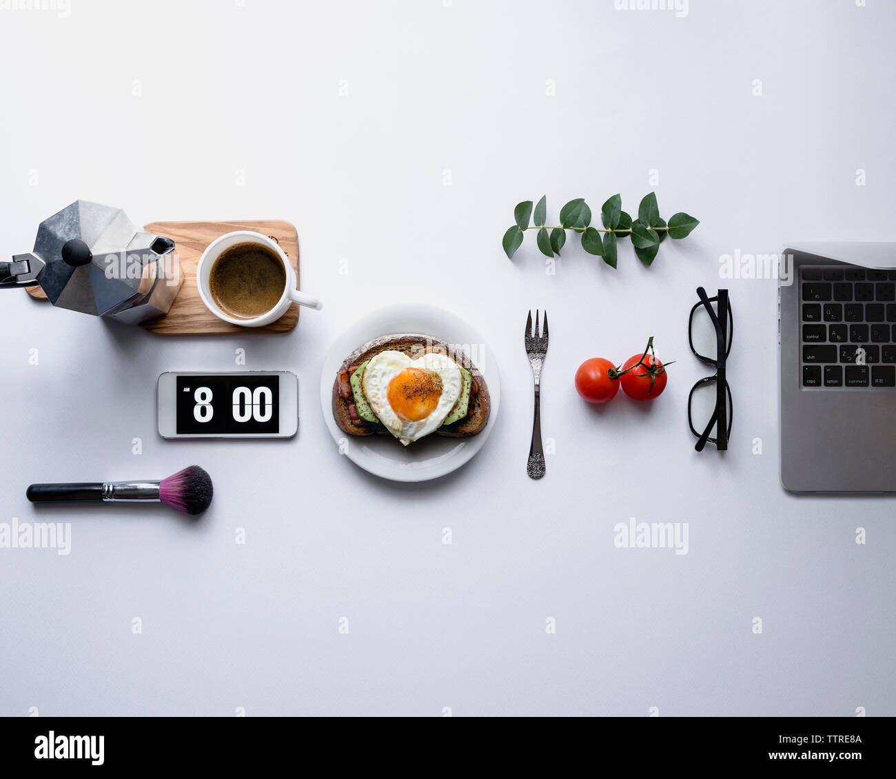 Overhead view of breakfast with accessories against white background ...