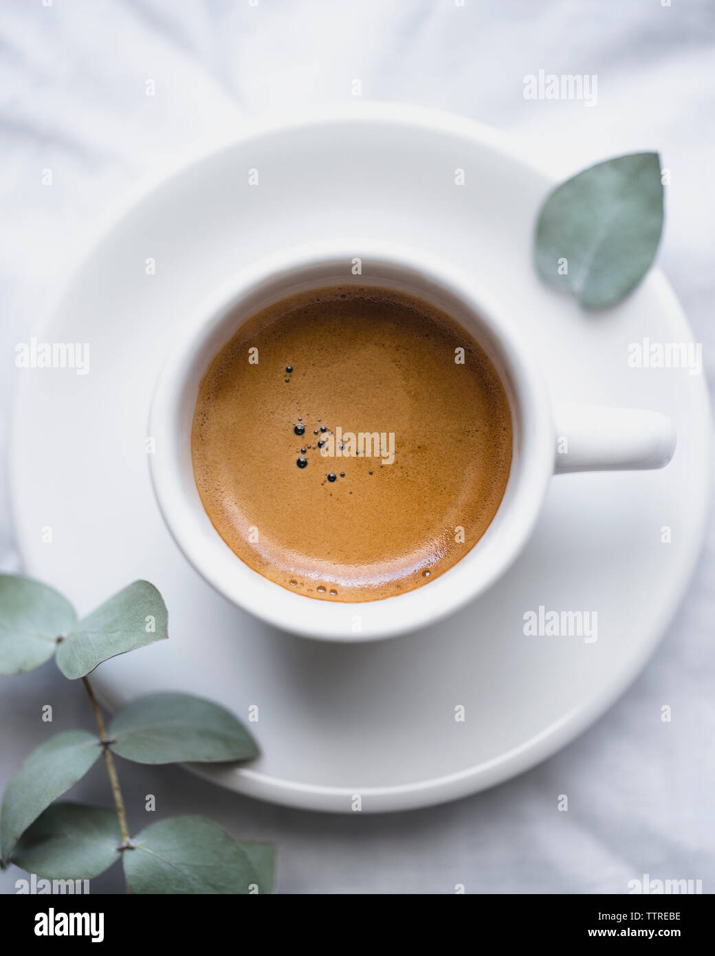 Overhead shot of coffee cup on table Stock Photo - Alamy