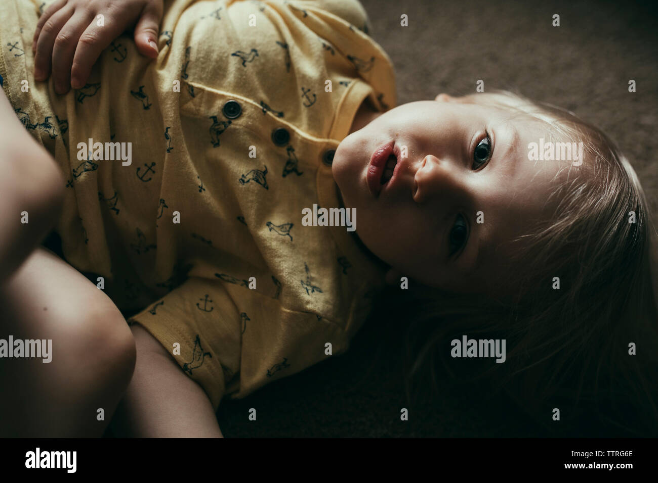 Boy lying down hi-res stock photography and images - Alamy